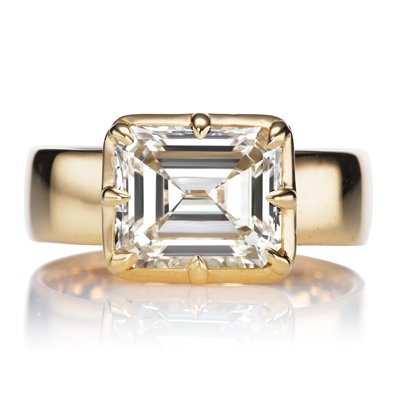 East-West Set Emerald Cut Diamond Collet Set in Chunky Yellow Gold ...